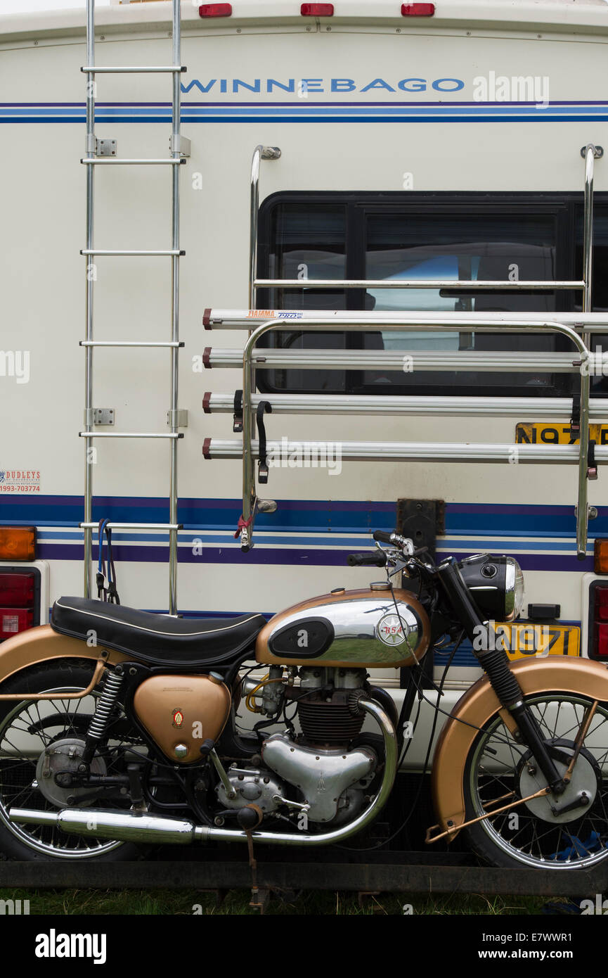 Vintage BSA motorcycle attached to the back of a Winnebago motorhome in ...