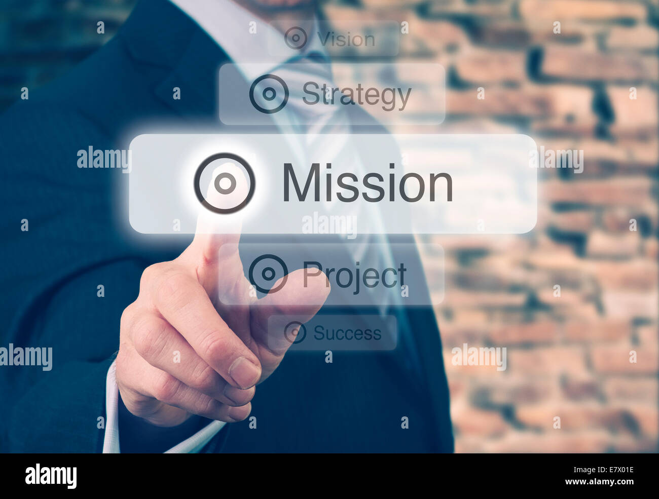 Businessman pressing a Mission concept button Stock Photo - Alamy