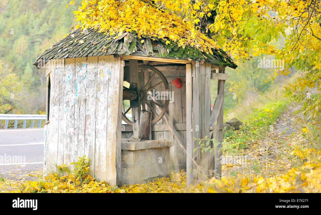 old fountain with shingle roof on autumn time, in Lepsa, Romania Stock ...