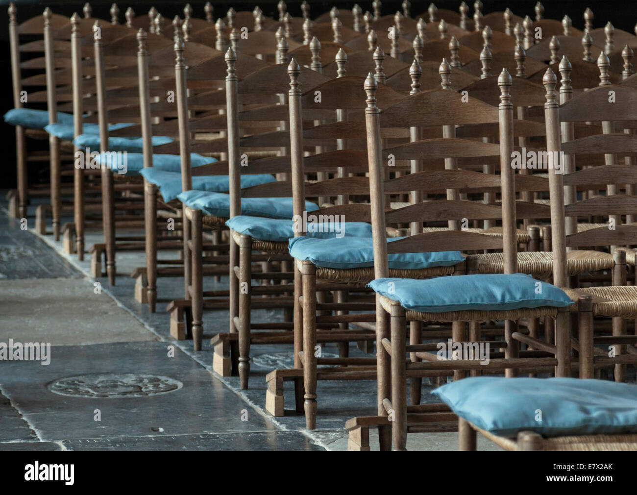 Rows of chairs with blue cushions on the aisle seats- St. Nicholas ...