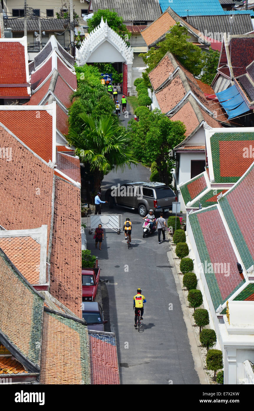 Thai people travel at wat arun temple by walk and riding bike for pray ...
