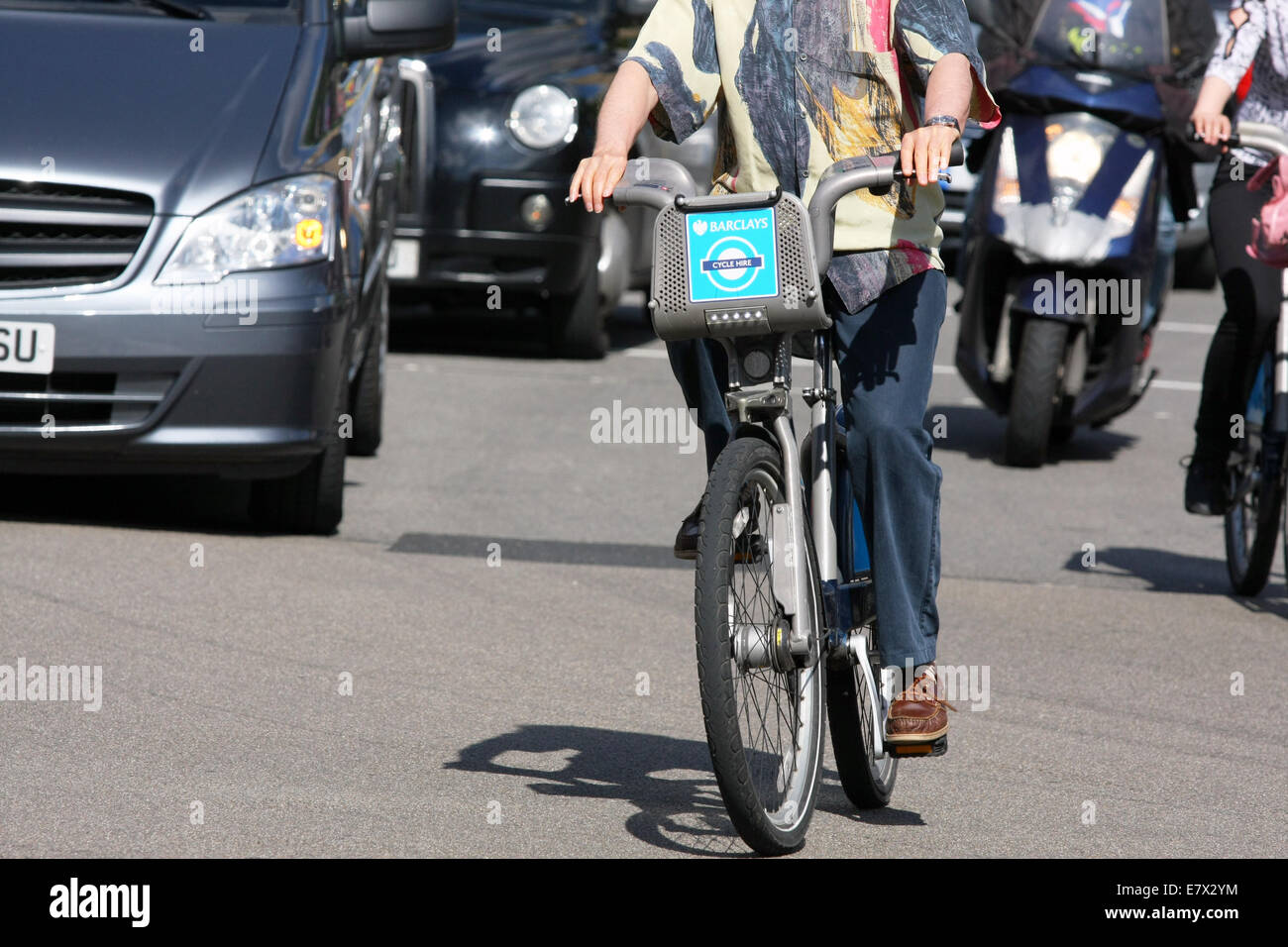 Cyclists with cars behind them hi-res stock photography and images - Alamy
