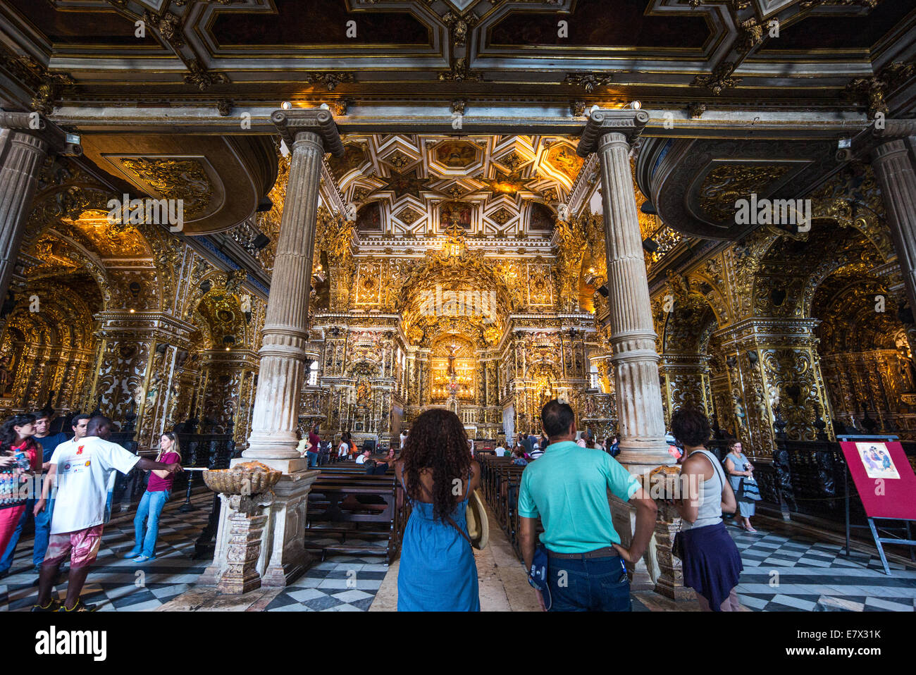 Brazil, Salvador, visitors looking at the statues of saints and gold ...