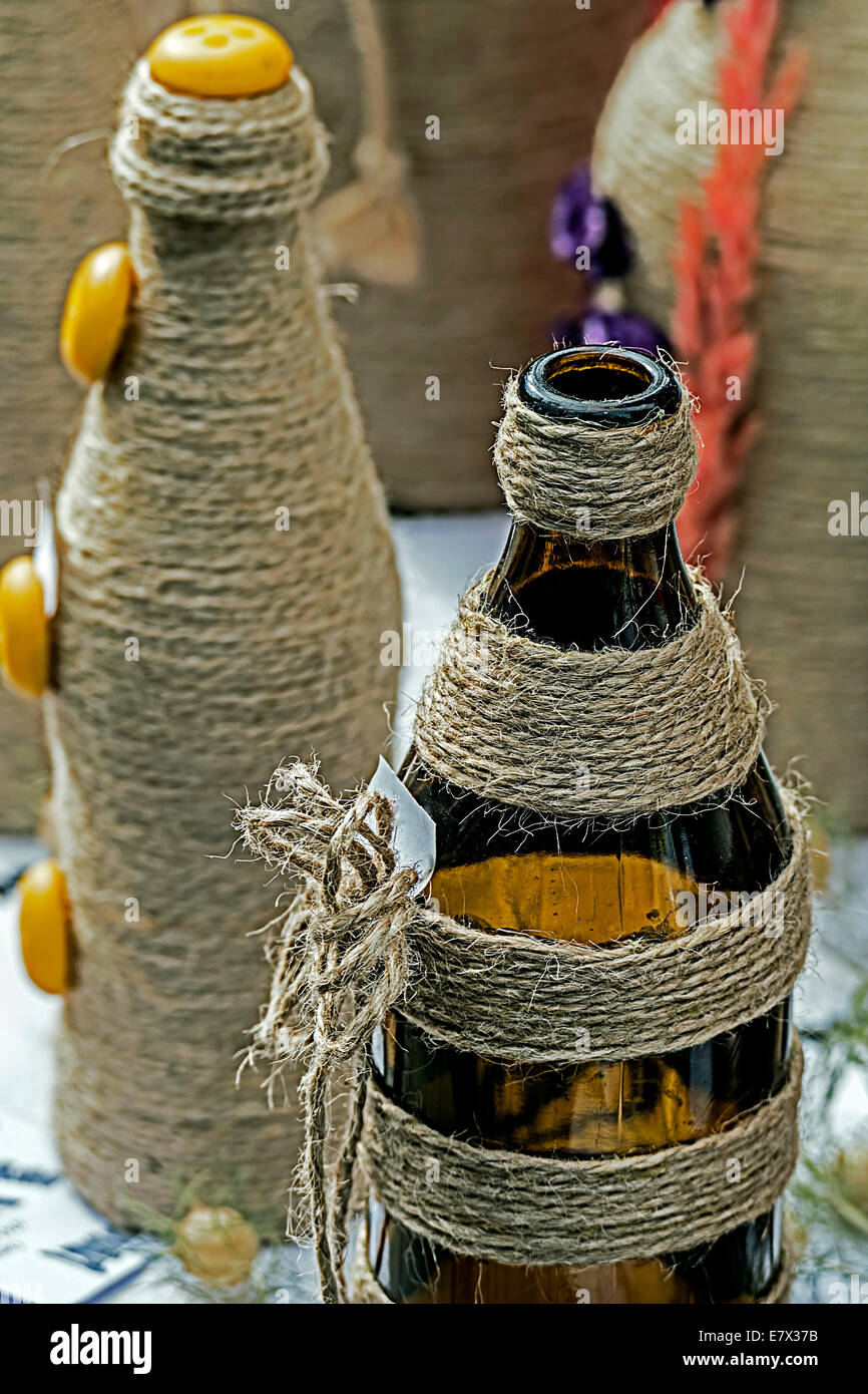 Bottles braided with flax rope and cufflinks Stock Photo - Alamy