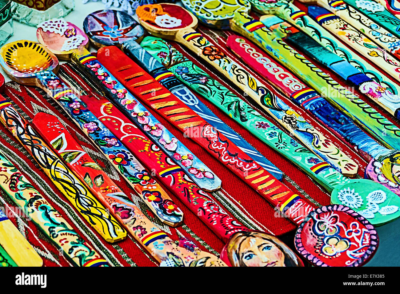 Painted wooden spoons with different color patterns Stock Photo - Alamy