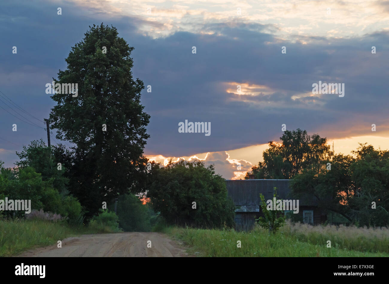 Sunrise over village Stock Photo - Alamy