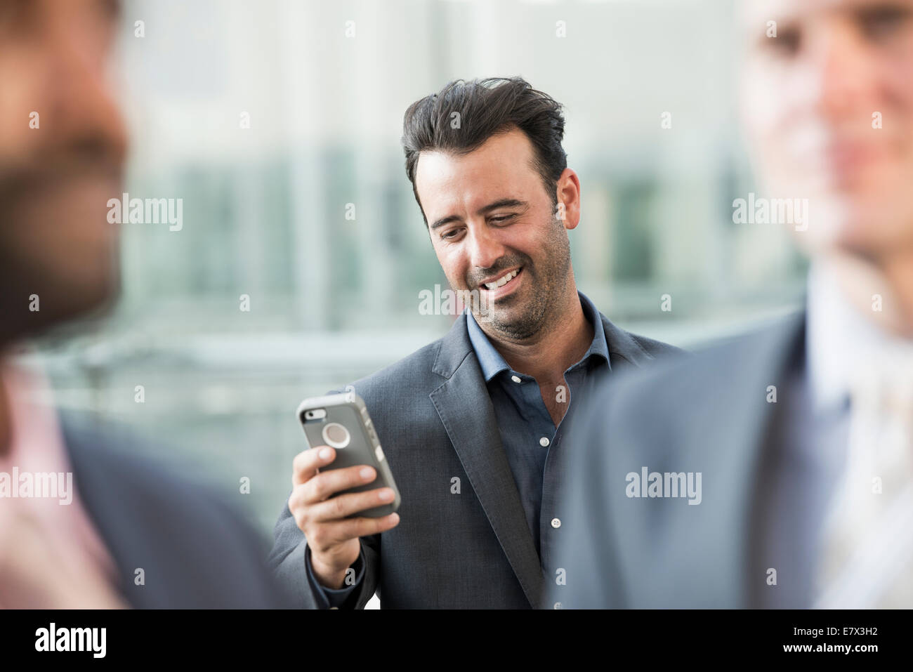 Business meeting checking mobile phone hi-res stock photography and ...