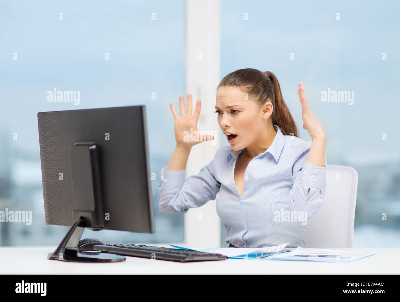 stressed woman with computer Stock Photo - Alamy