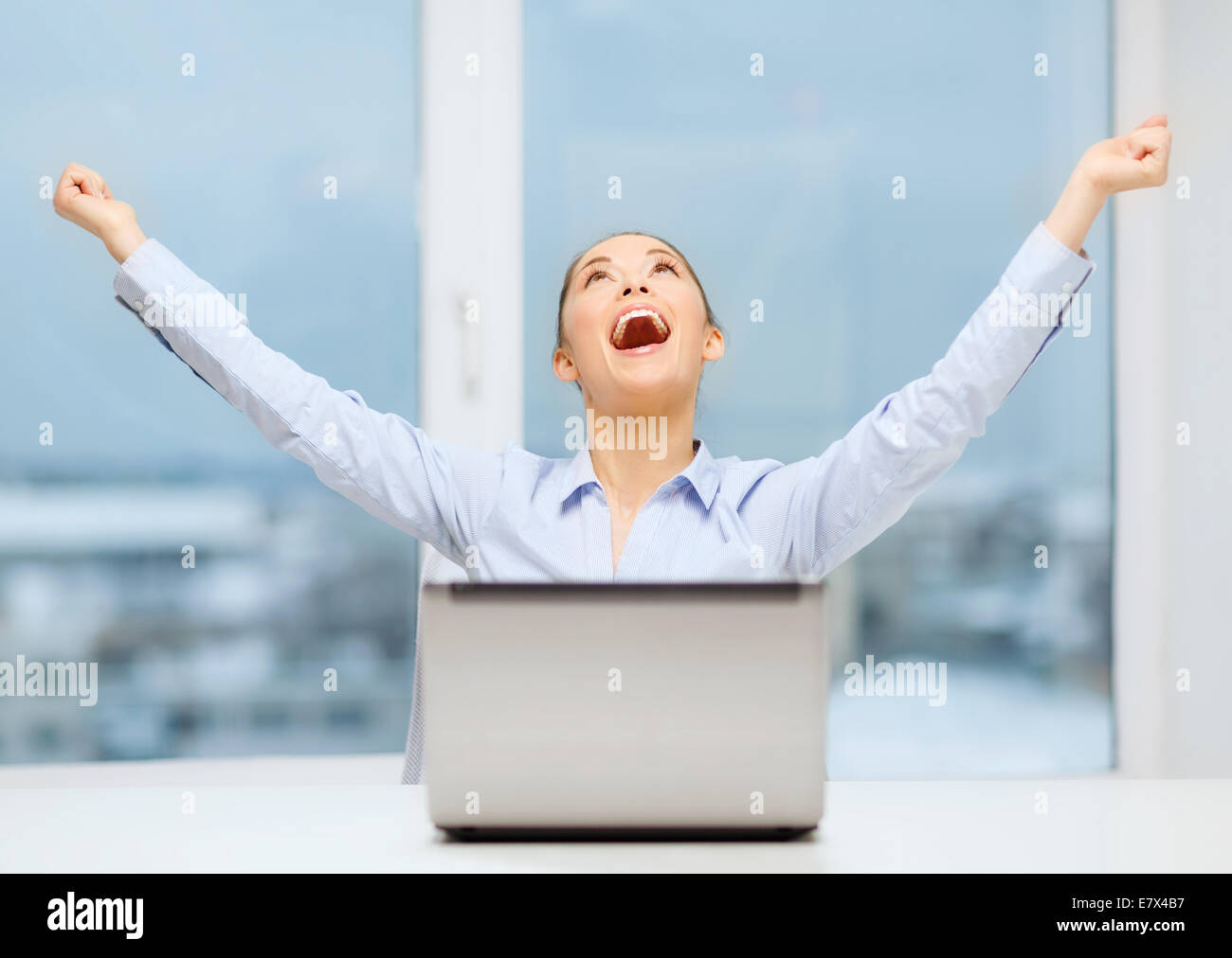 screaming businesswoman with laptop in office Stock Photo - Alamy
