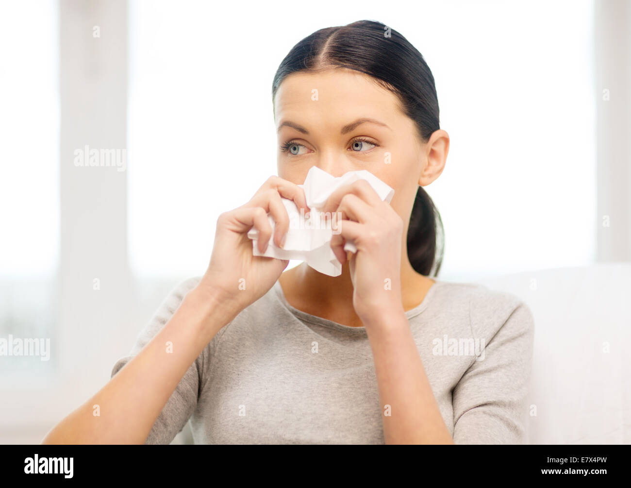 sick girl with paper tissue Stock Photo - Alamy