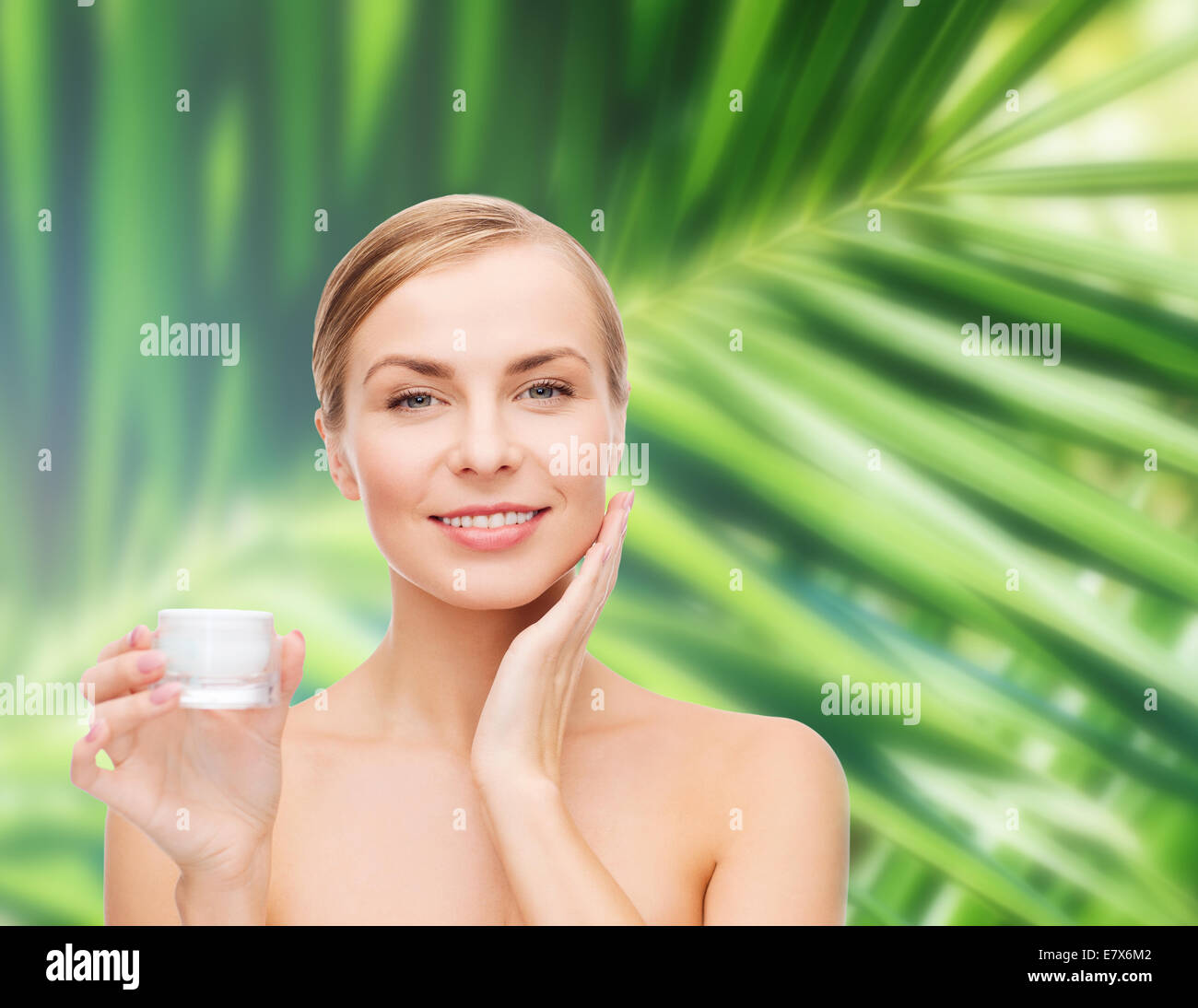 woman applying cream on her skin Stock Photo - Alamy
