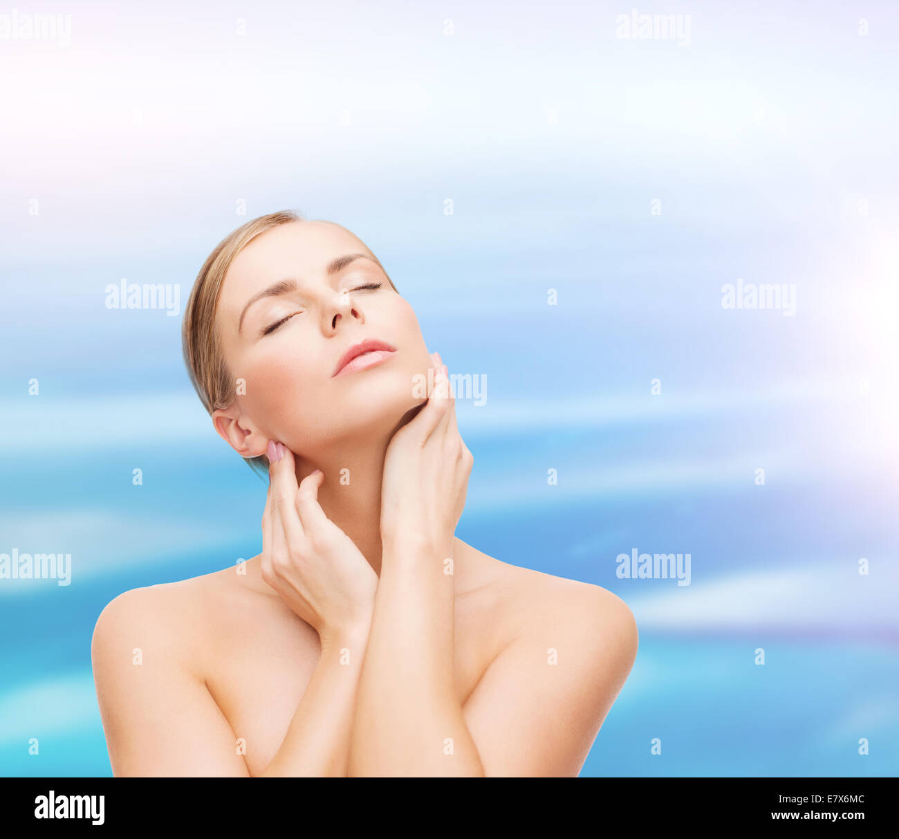 beautiful woman touching her face with closed eyes Stock Photo - Alamy