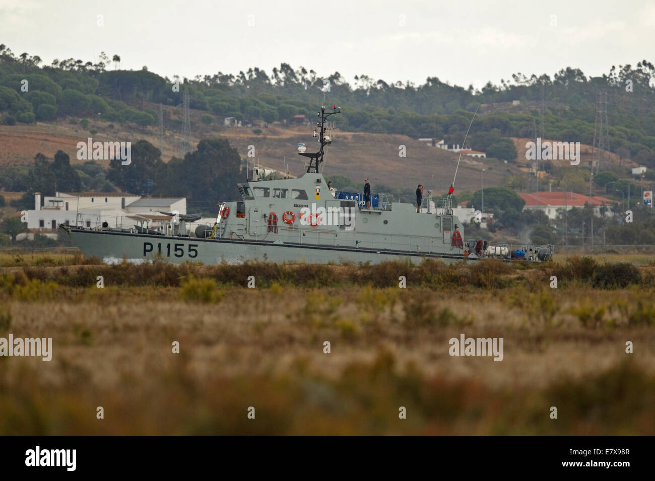 Portuguese naval vessel sailing on the border river, the Rio Guadiana ...