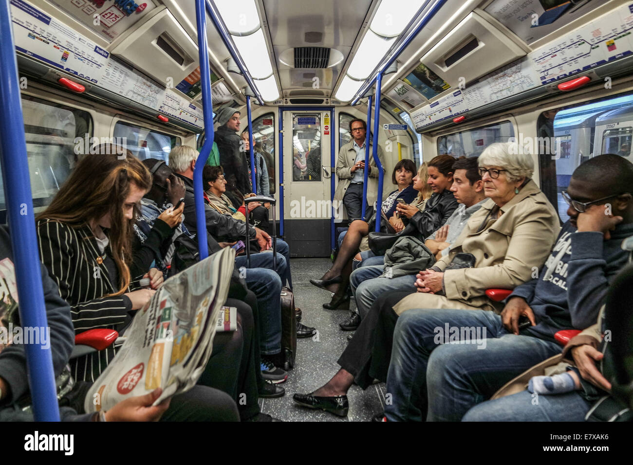 Passengers riding a London tube train Stock Photo - Alamy