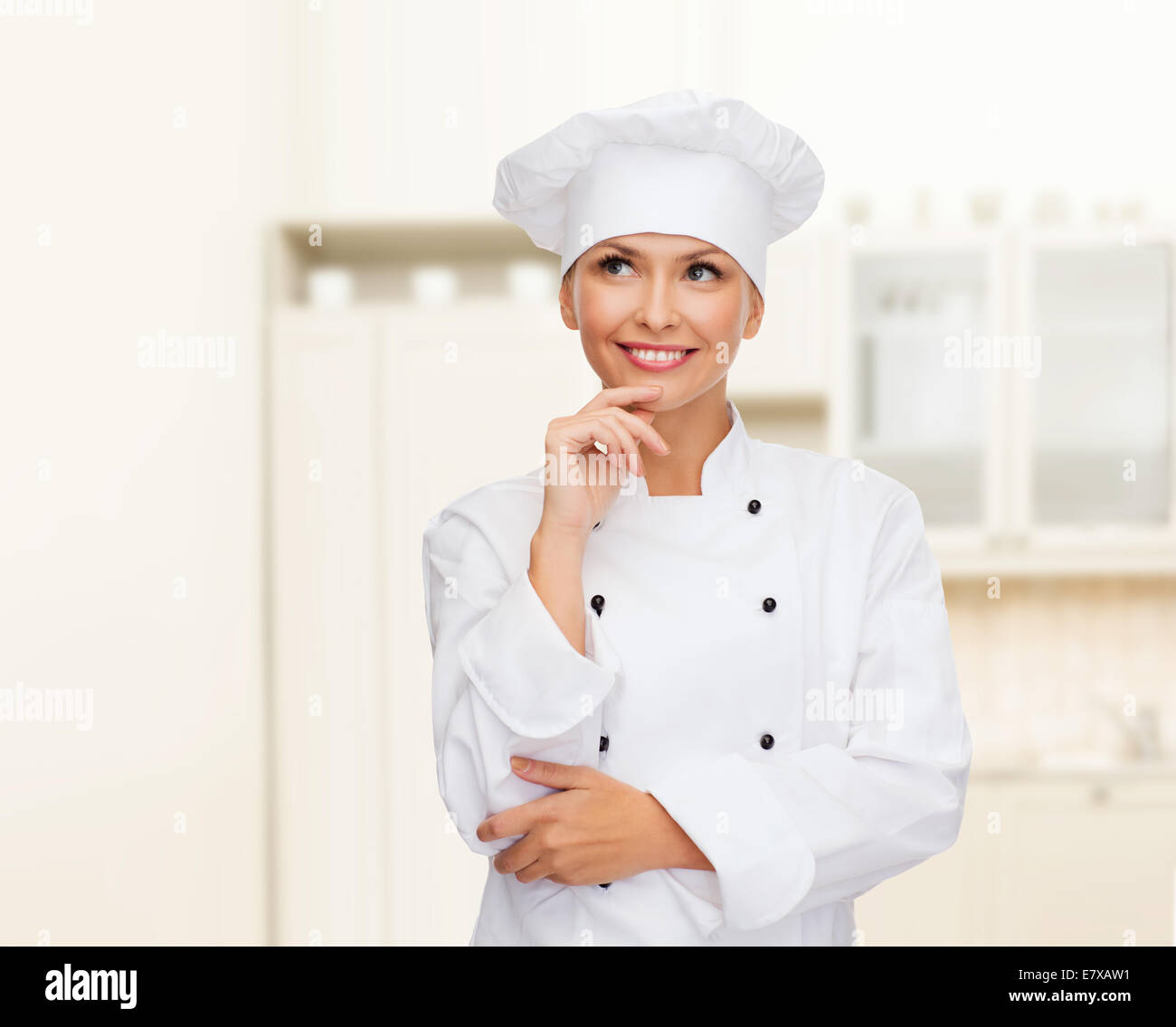 smiling female chef dreaming Stock Photo - Alamy