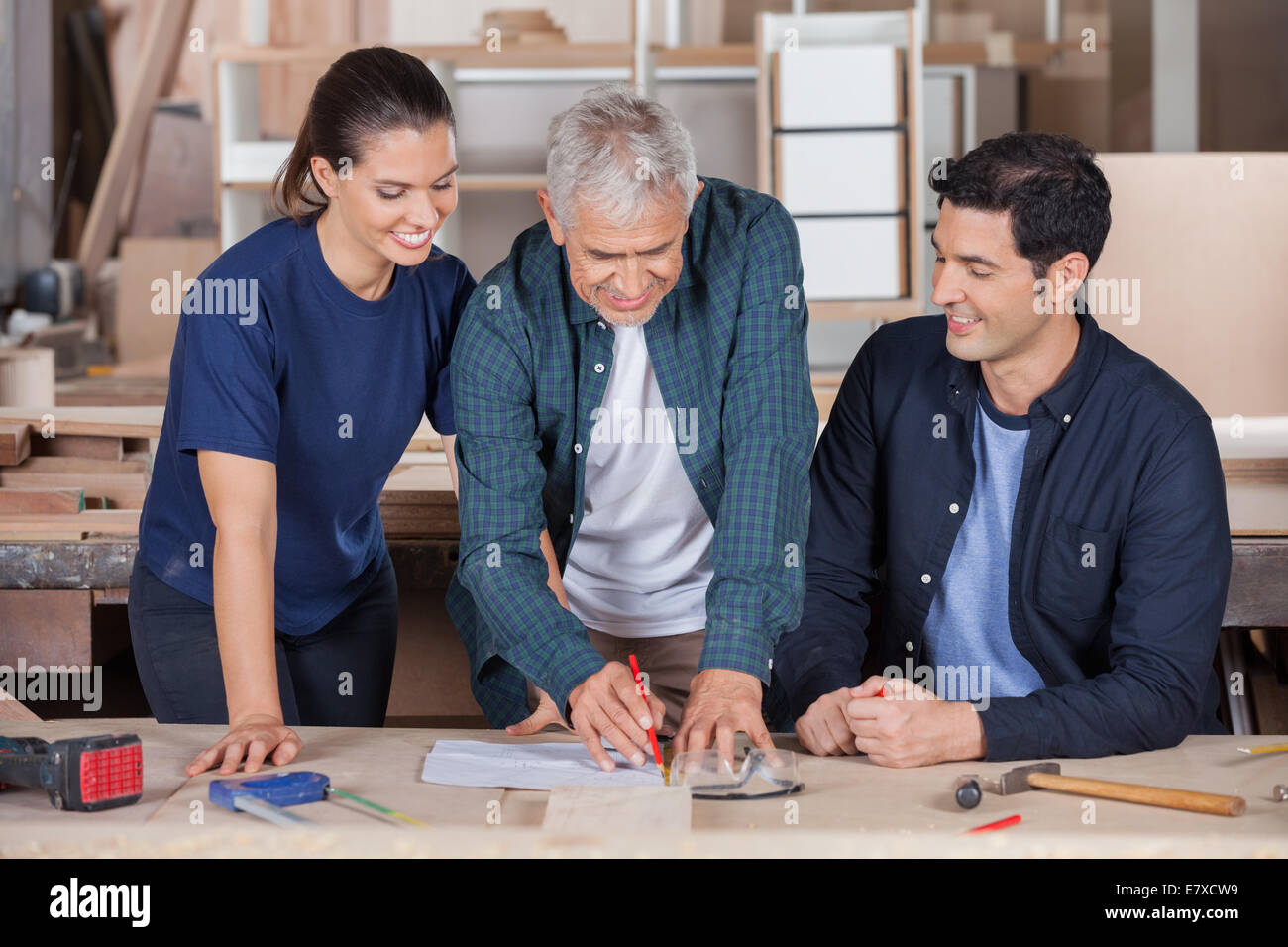 Woman man teamwork carpentry shop hi-res stock photography and images ...