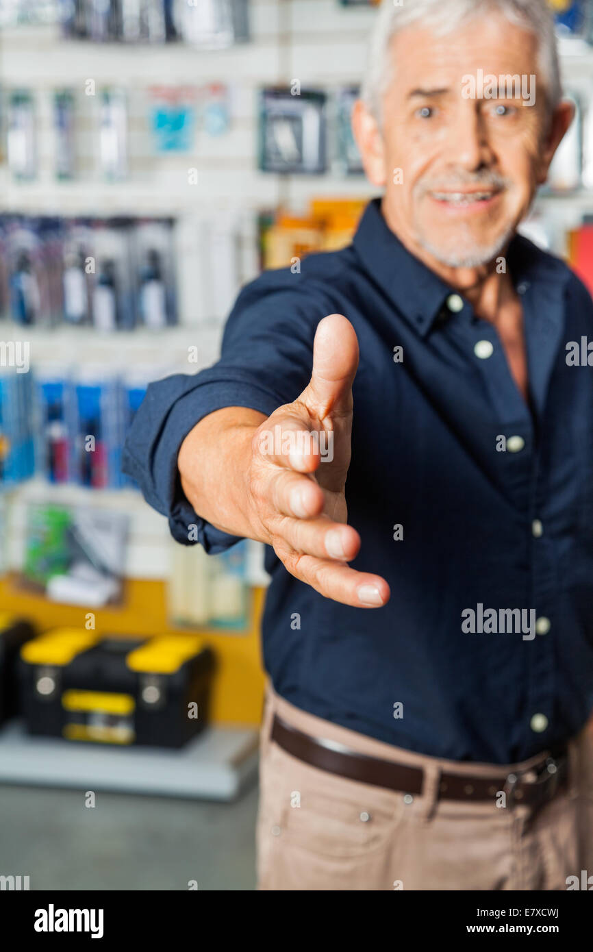 Man Gesturing Handshake In Hardware Store Stock Photo - Alamy