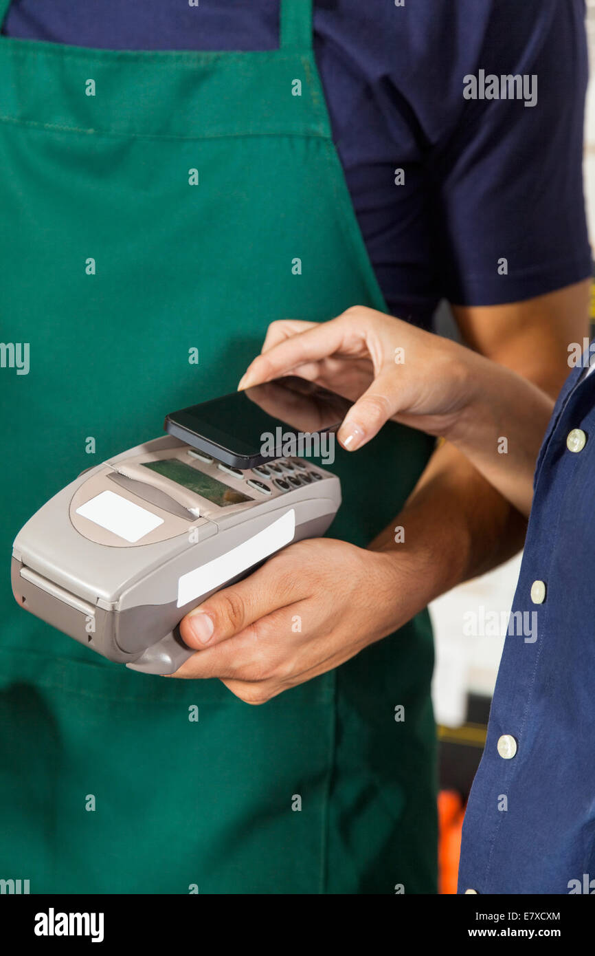 Cell phone salesperson with customer hi-res stock photography and ...