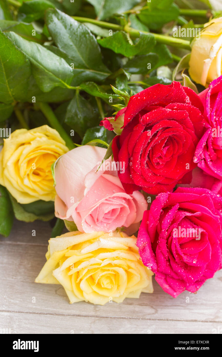 yellow and pink roses on table Stock Photo - Alamy
