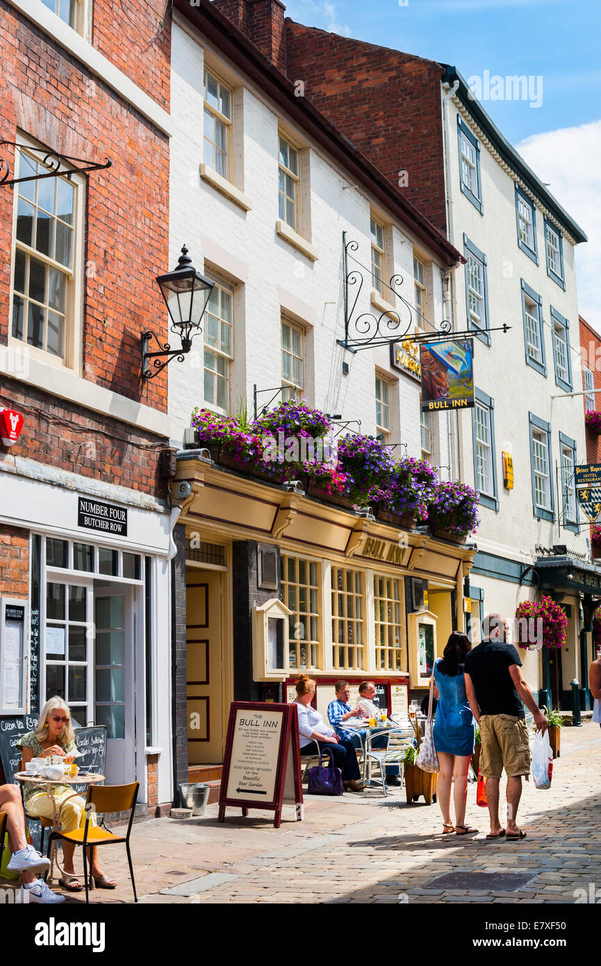 People sitting outside pubs and cafes in Butcher Row, Shrewsbury ...