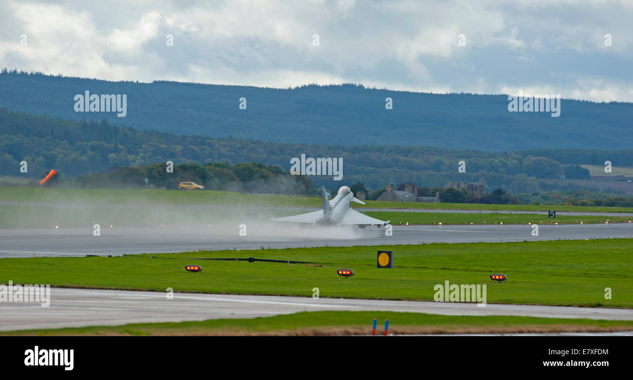 Eurofighter Typhoon FRG4 taking off from wet runway RAF Lossiemouth ...