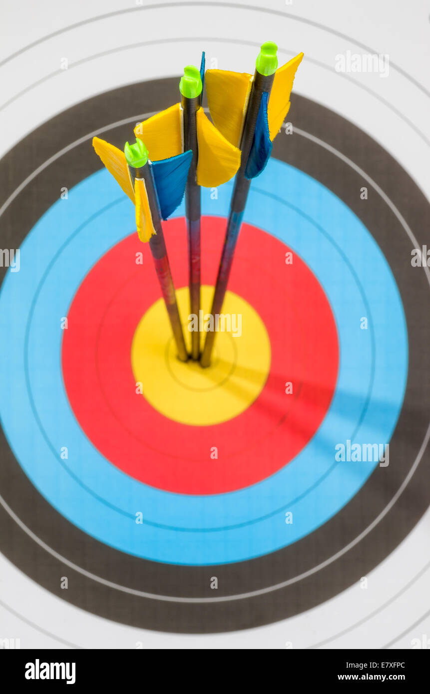 Target with three arrows in the center Stock Photo - Alamy
