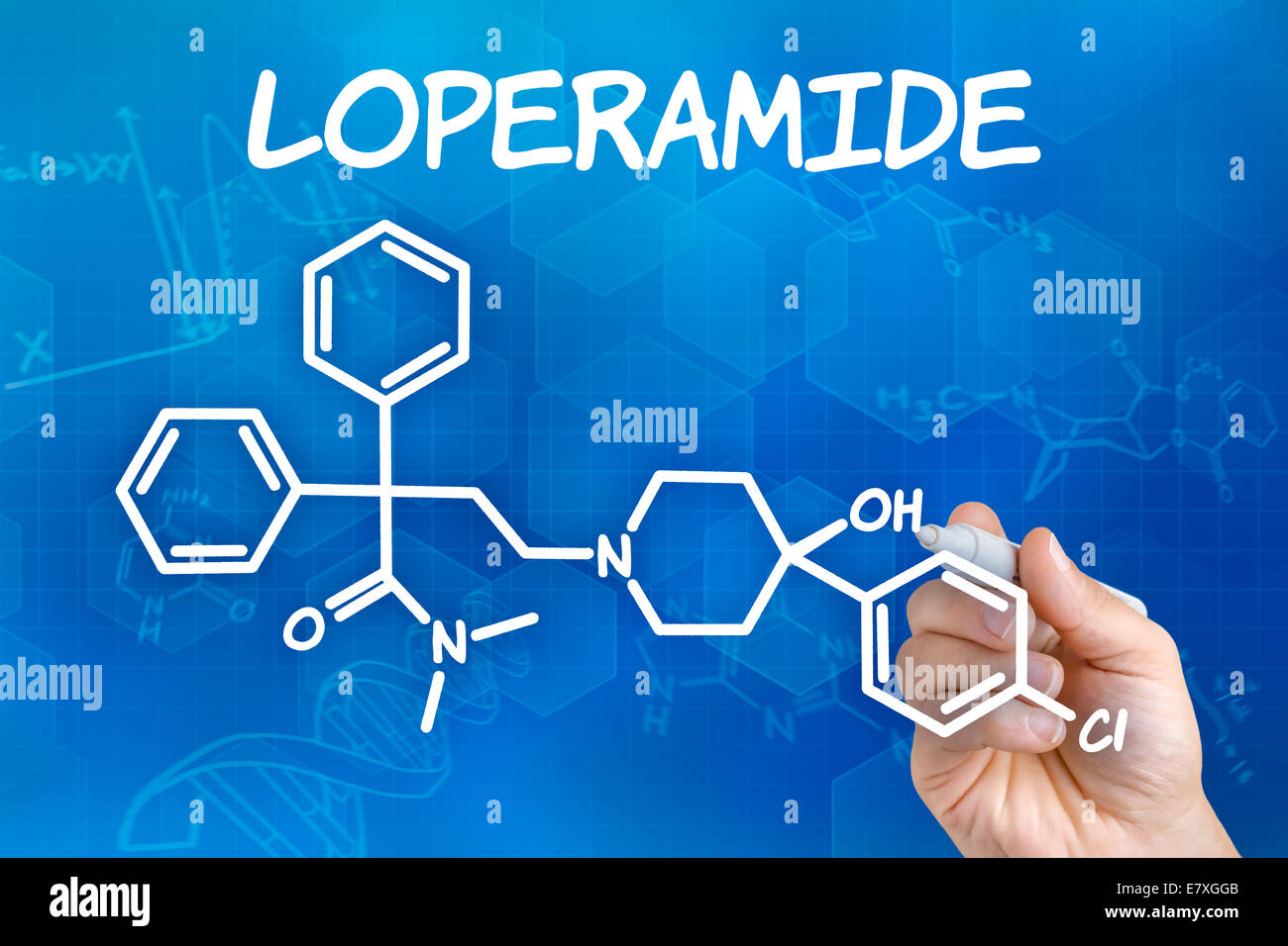 Hand with pen drawing the chemical formula of Loperamide Stock Photo ...