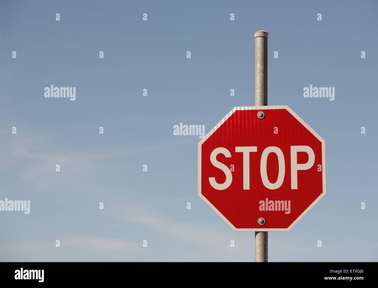 Stop sign and blue sky Stock Photo - Alamy