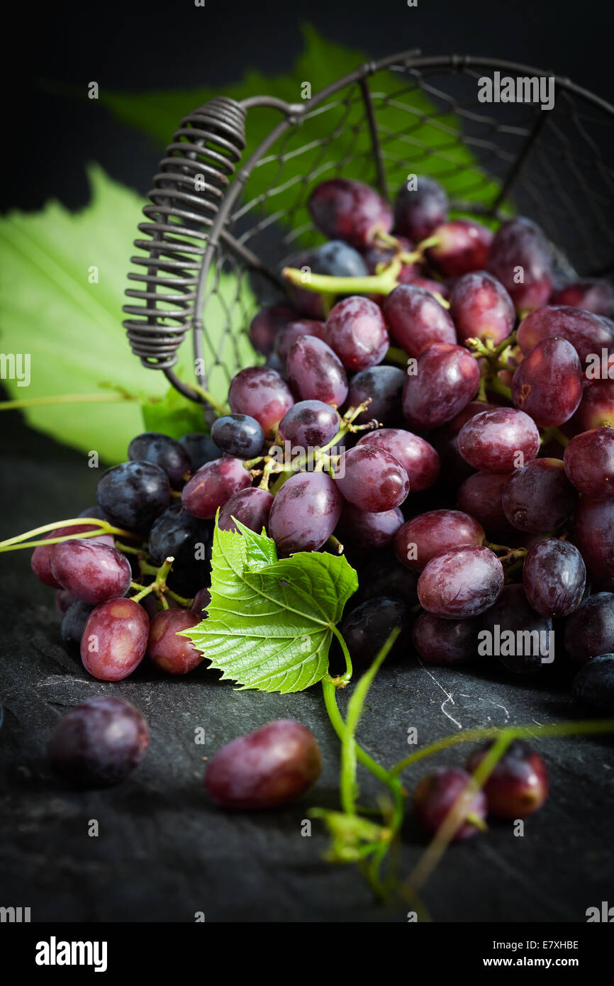 Fresh red grapes on dark background Stock Photo - Alamy