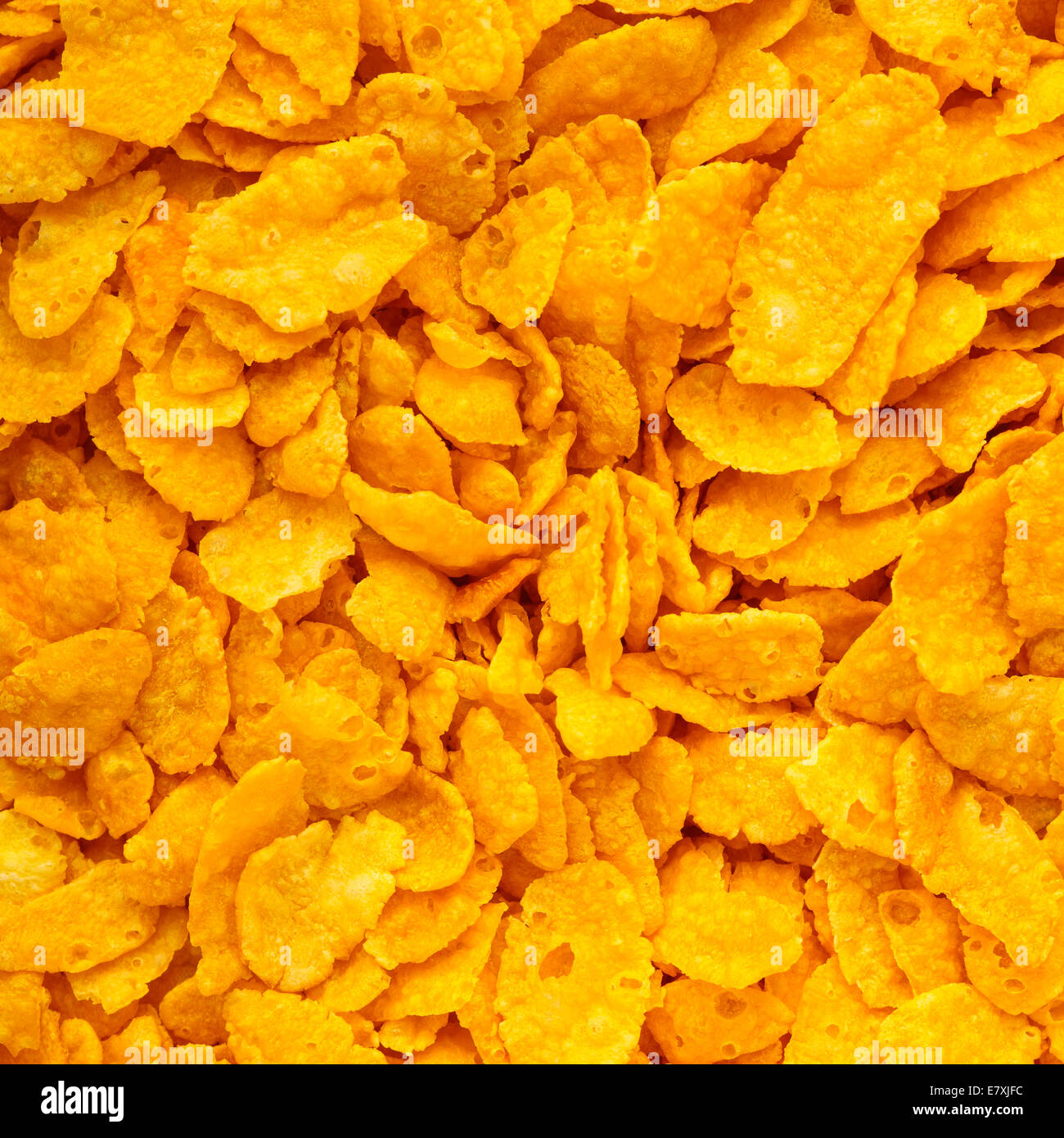 Closeup of many corn flakes breakfast morning meal as food background ...