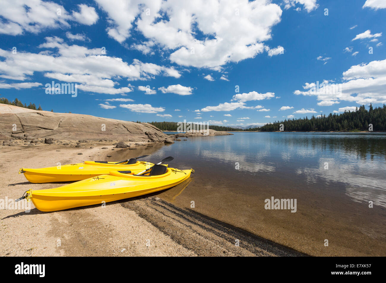 Pair of Yellow Kayaks on a Beautiful Mountain Lake Shore Stock Photo ...