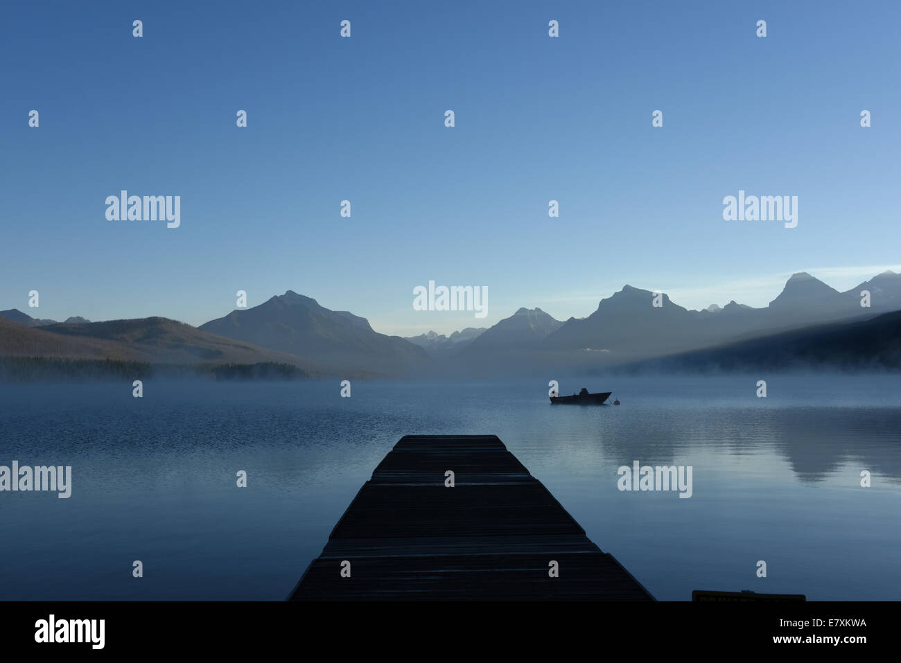 View from Apgar of a boat and Lake McDonald in Glacier National Park ...