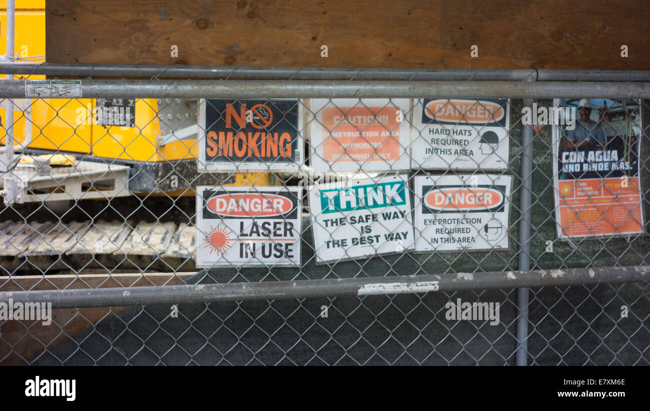 Fence with signs Stock Photo - Alamy
