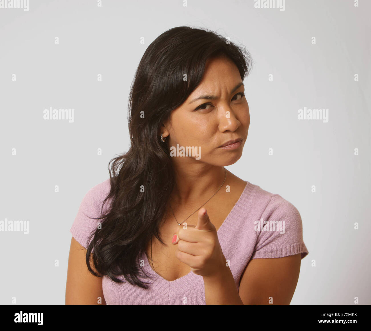 Woman pointing finger angry hi-res stock photography and images - Alamy