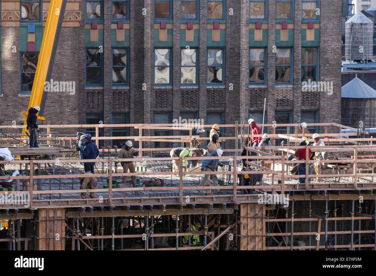 High-rise Building Construction Site with tradesmen, NYC, USA Stock ...