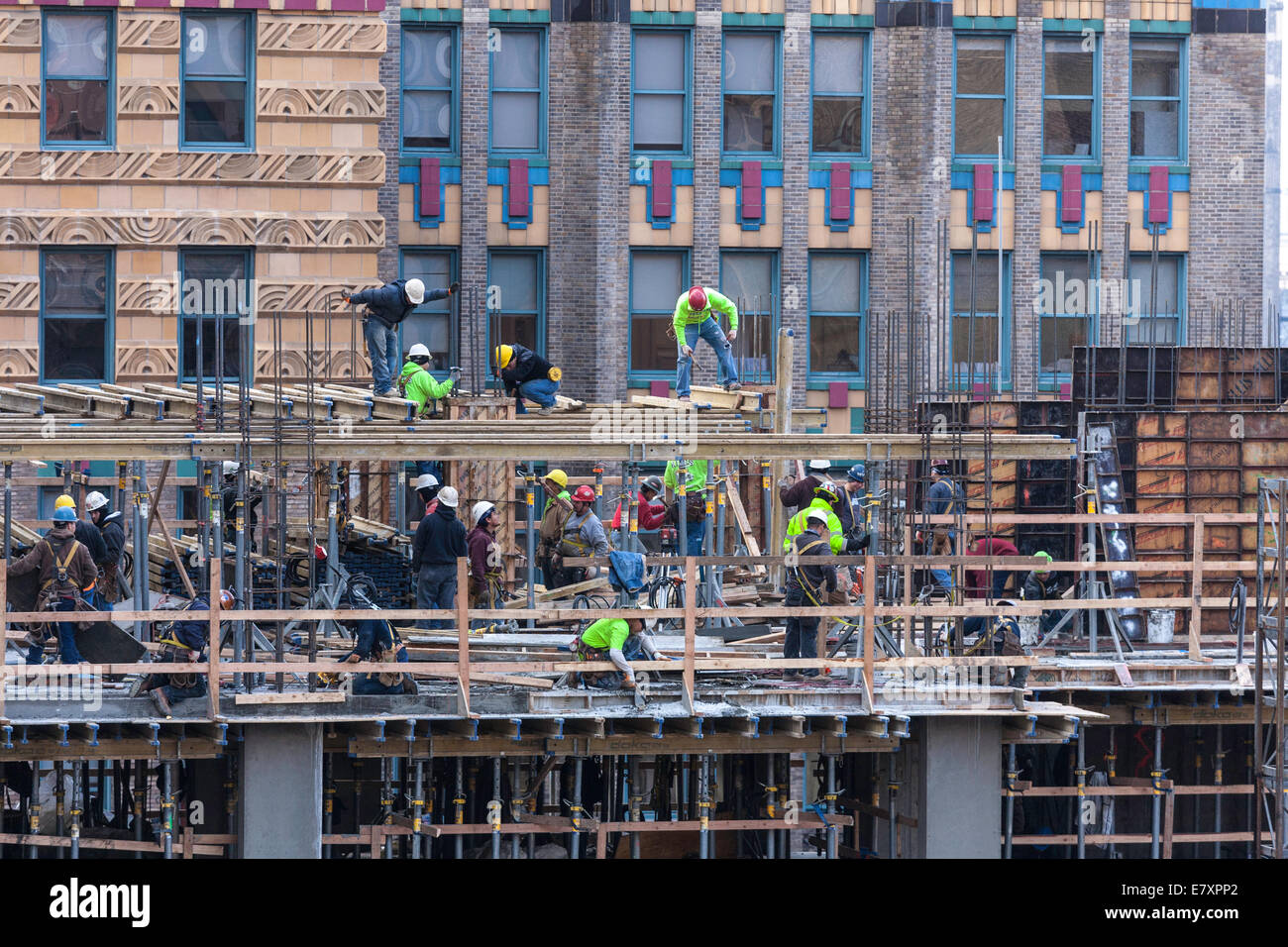 High-rise Building Construction Site with tradesmen Stock Photo - Alamy