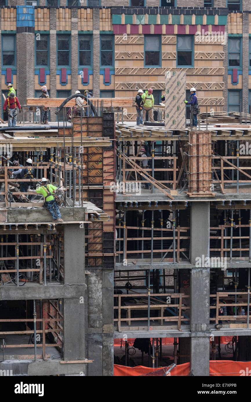 High-rise Building Construction Site with tradesmen Stock Photo - Alamy