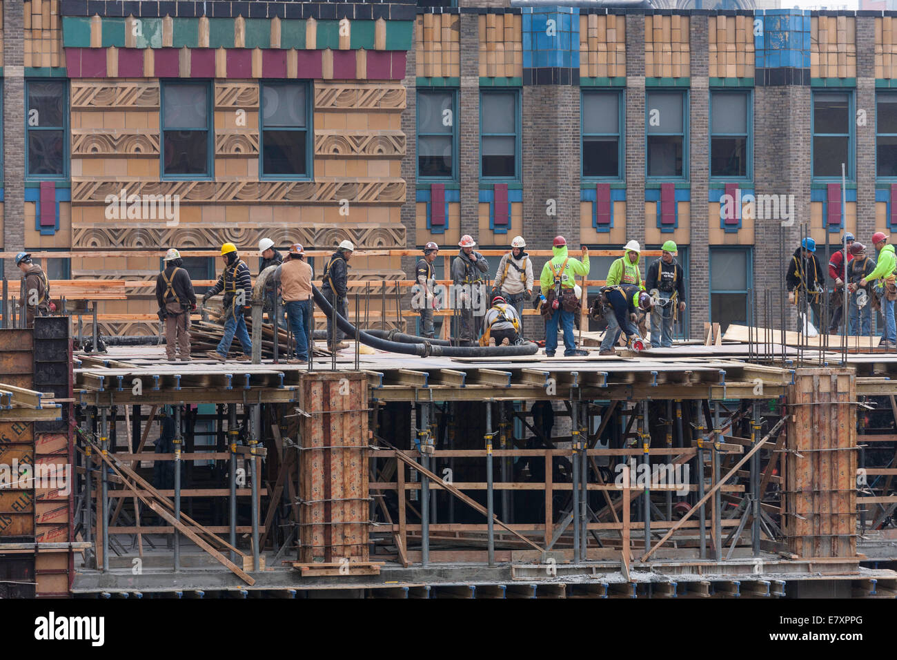 High-rise Building Construction Site with tradesmen Stock Photo - Alamy