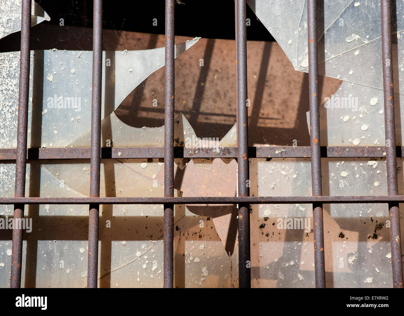 A smashed window in derelict building Stock Photo - Alamy