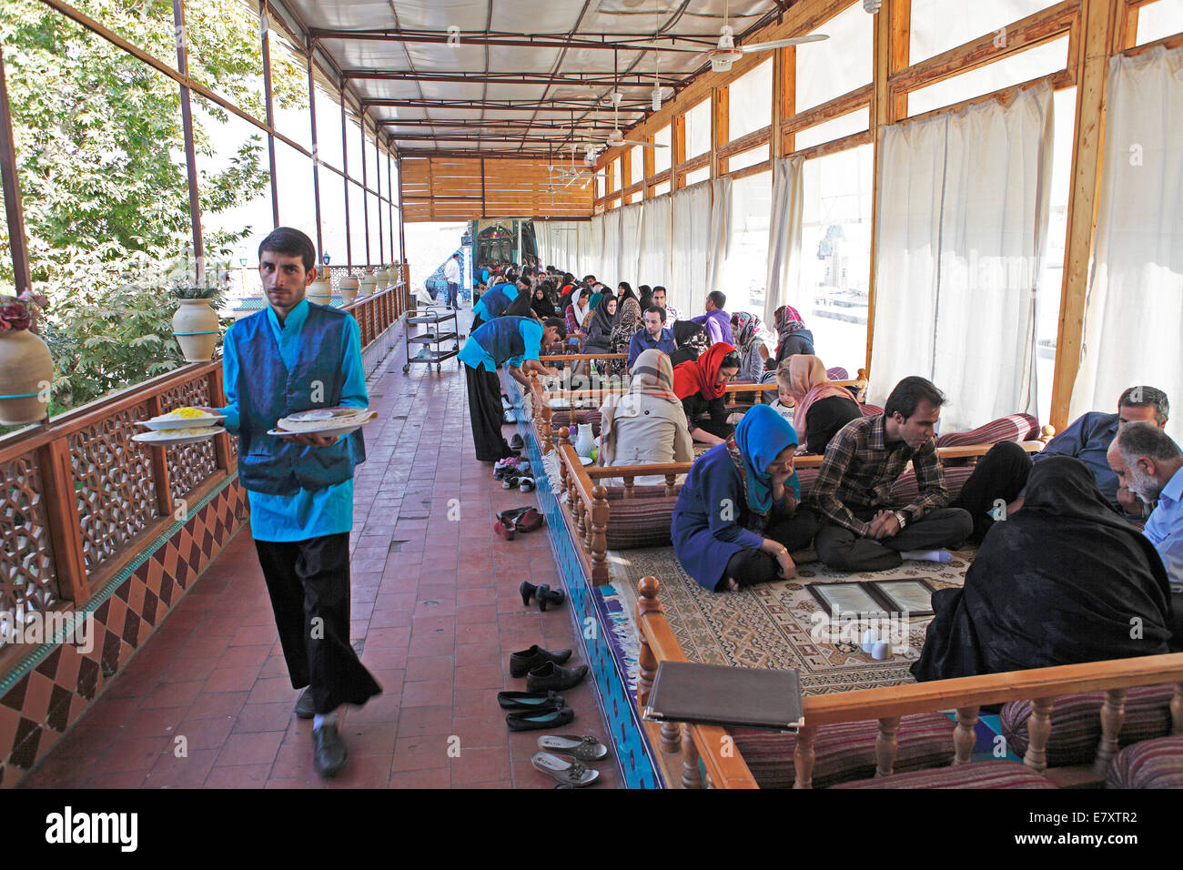 Young Iranians having lunch in a traditional restaurant, Bazaar ...