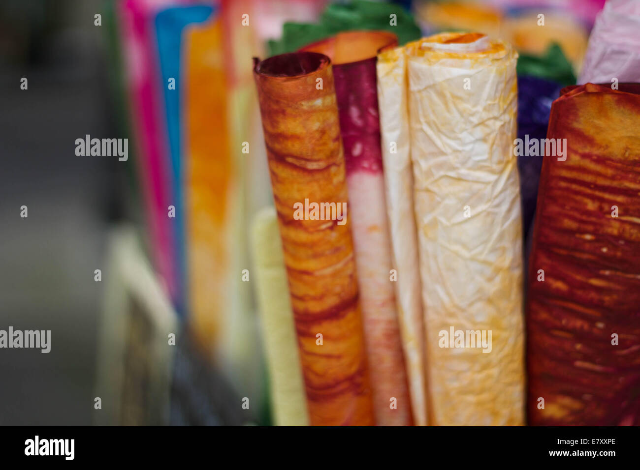 Rolls of colorful paper outside an art supply store Stock Photo - Alamy
