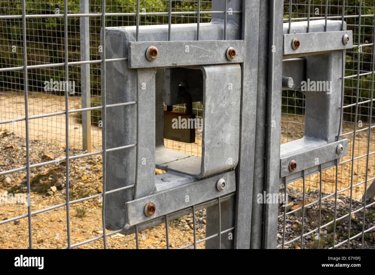 A secure gate part of a fence around a compound to keep it secure Stock ...
