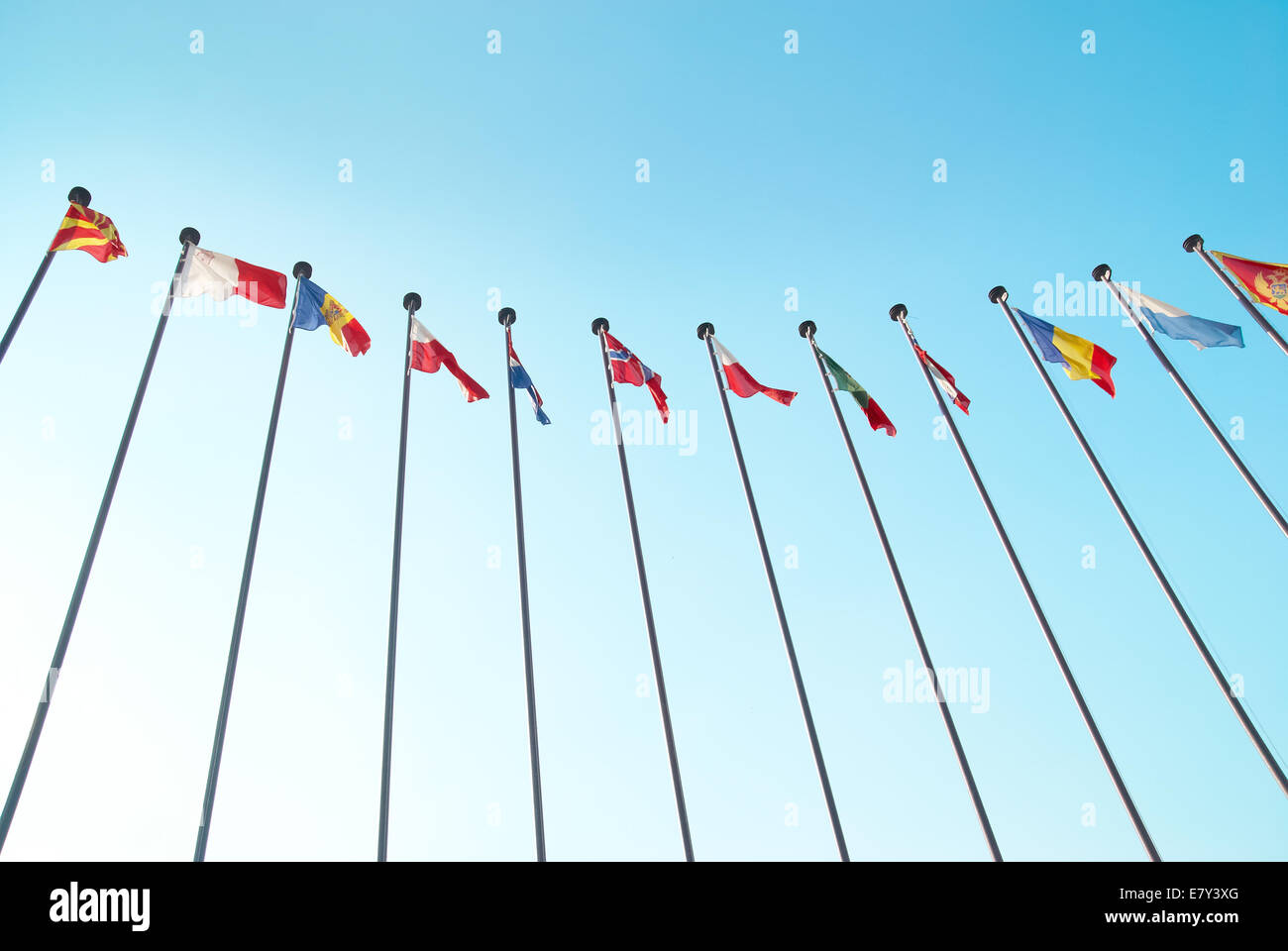 Row of european flags against blue sky background Stock Photo - Alamy