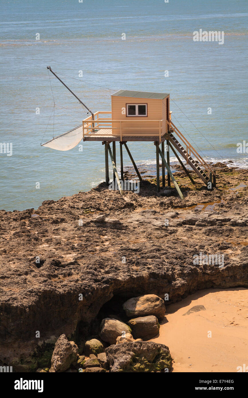 Traditional fisherman huts on stilts with carrelets nets on the coast ...