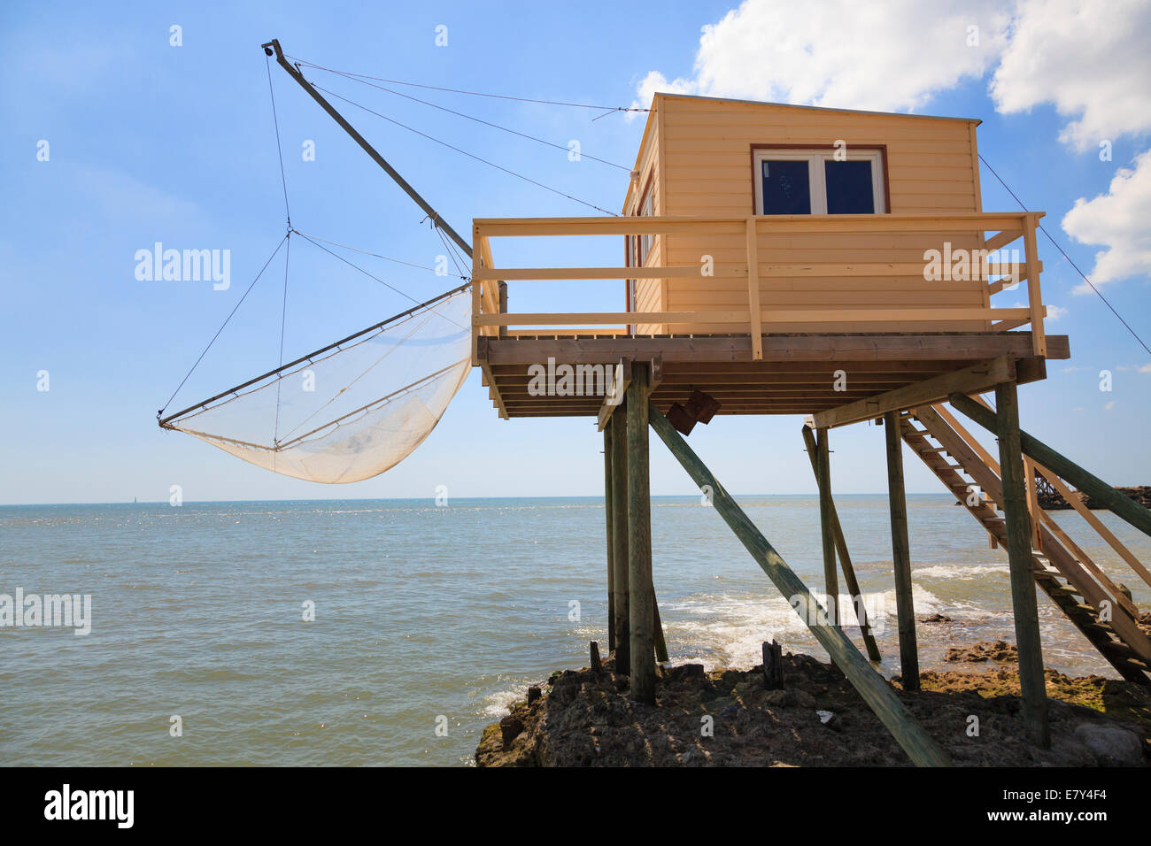 Traditional fisherman hut on stilts with carrelets nets on the coast of ...