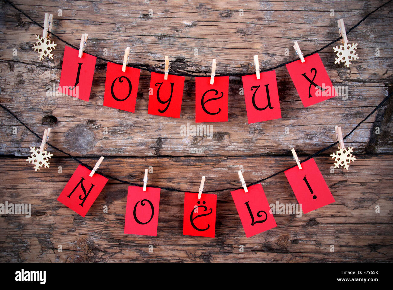 Red Tags Hanging on a Line with the French Words Joyeux Noël on it ...