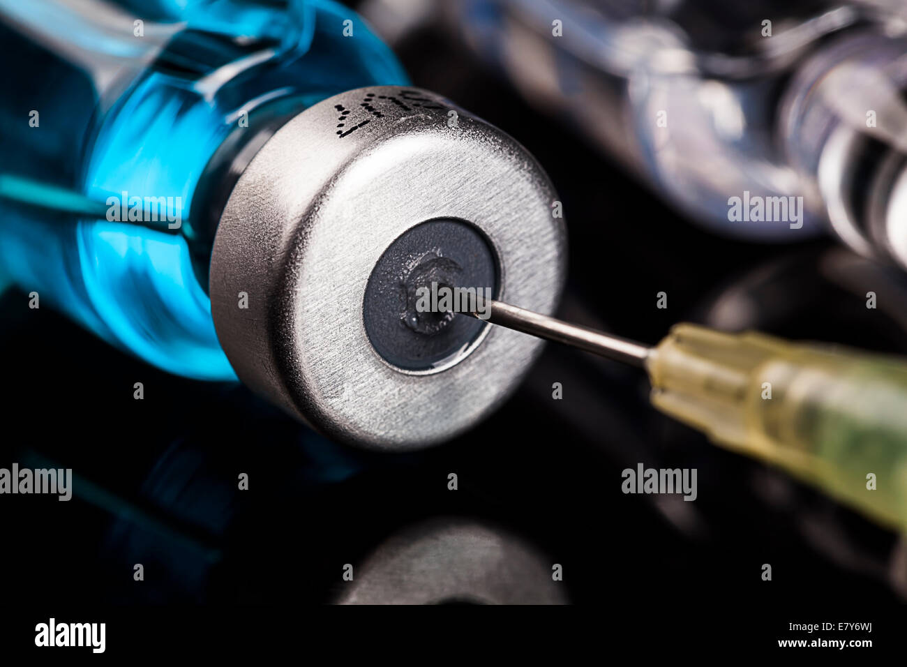 Syringe needle in bottle hi-res stock photography and images - Alamy