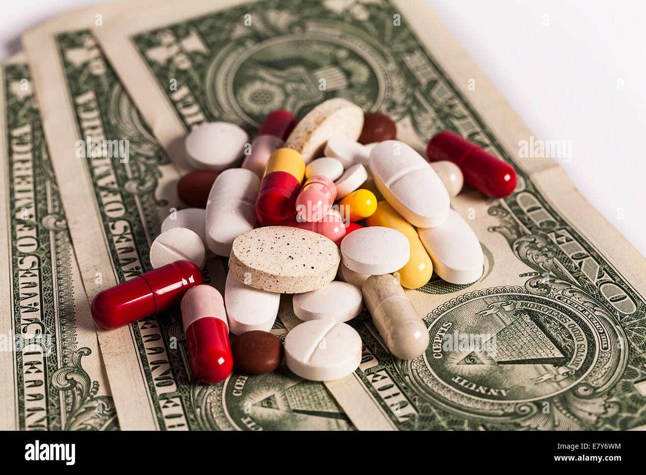 medicine tablets on money Stock Photo - Alamy