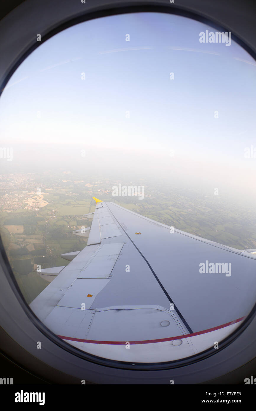 Aeroplane window and wing of aircraft Stock Photo - Alamy