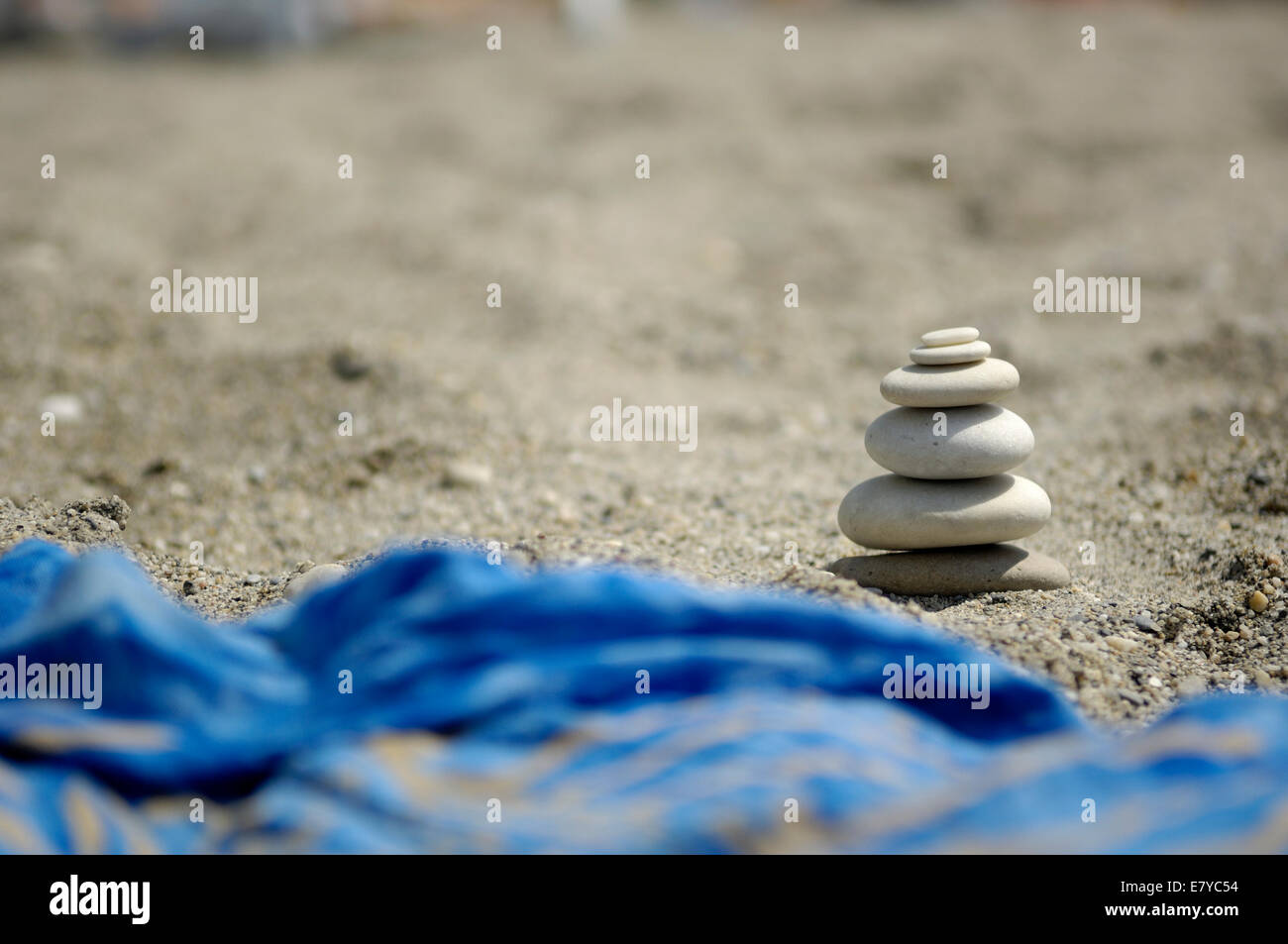 Stones in the sand Stock Photo - Alamy
